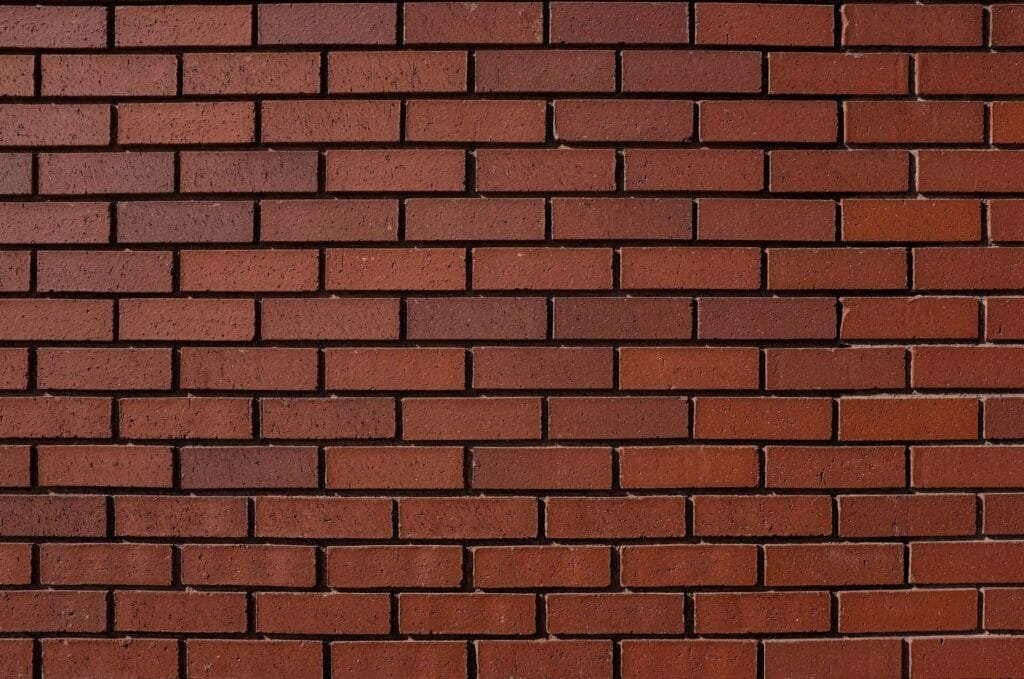 What is the weight of a brick in kg